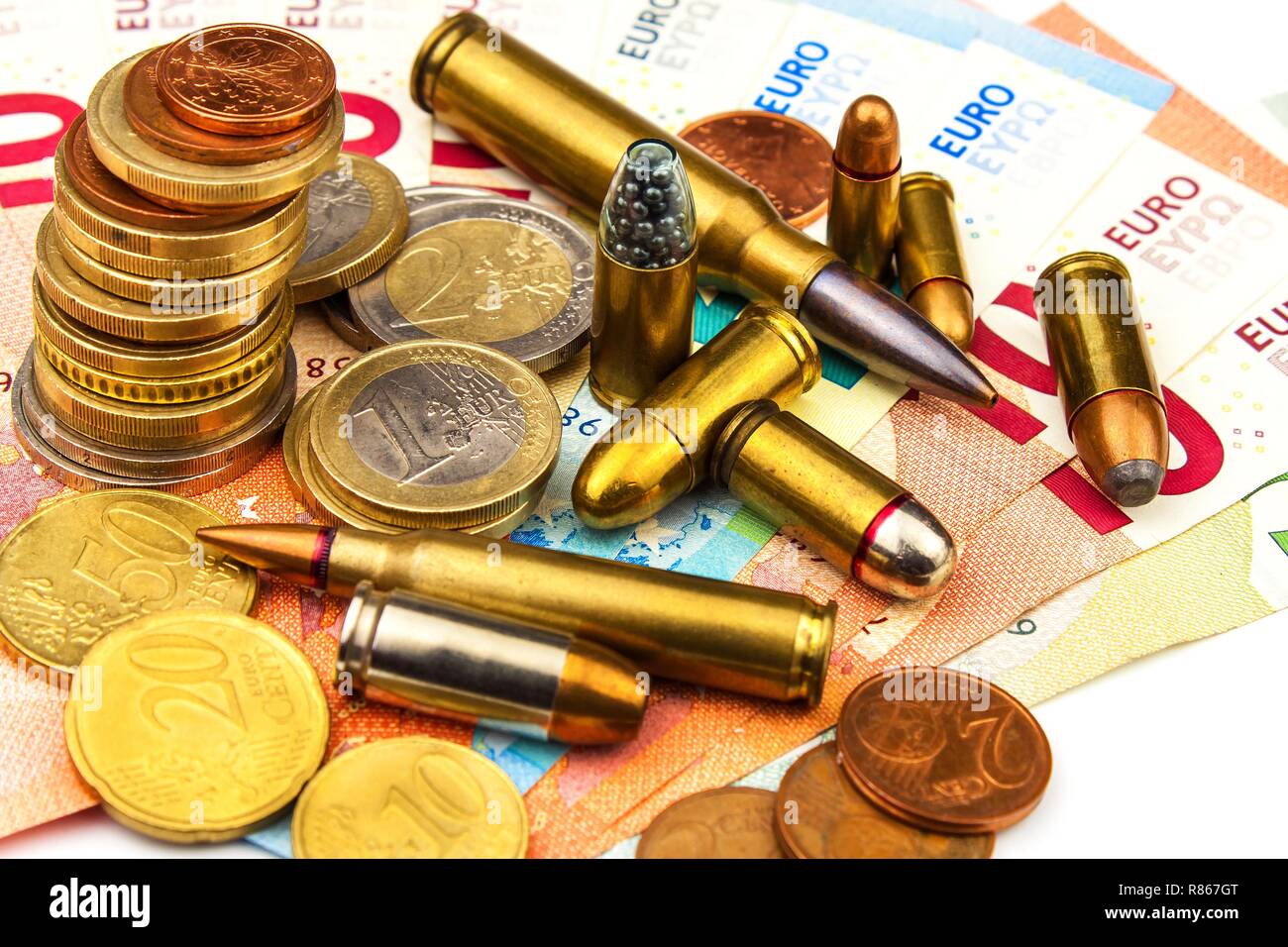 Euro coins and banknotes and cartridges of different caliber. Illegal ...