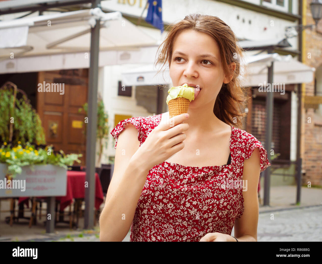Teenage girl eating ice cream cone hi-res stock photography and images ...