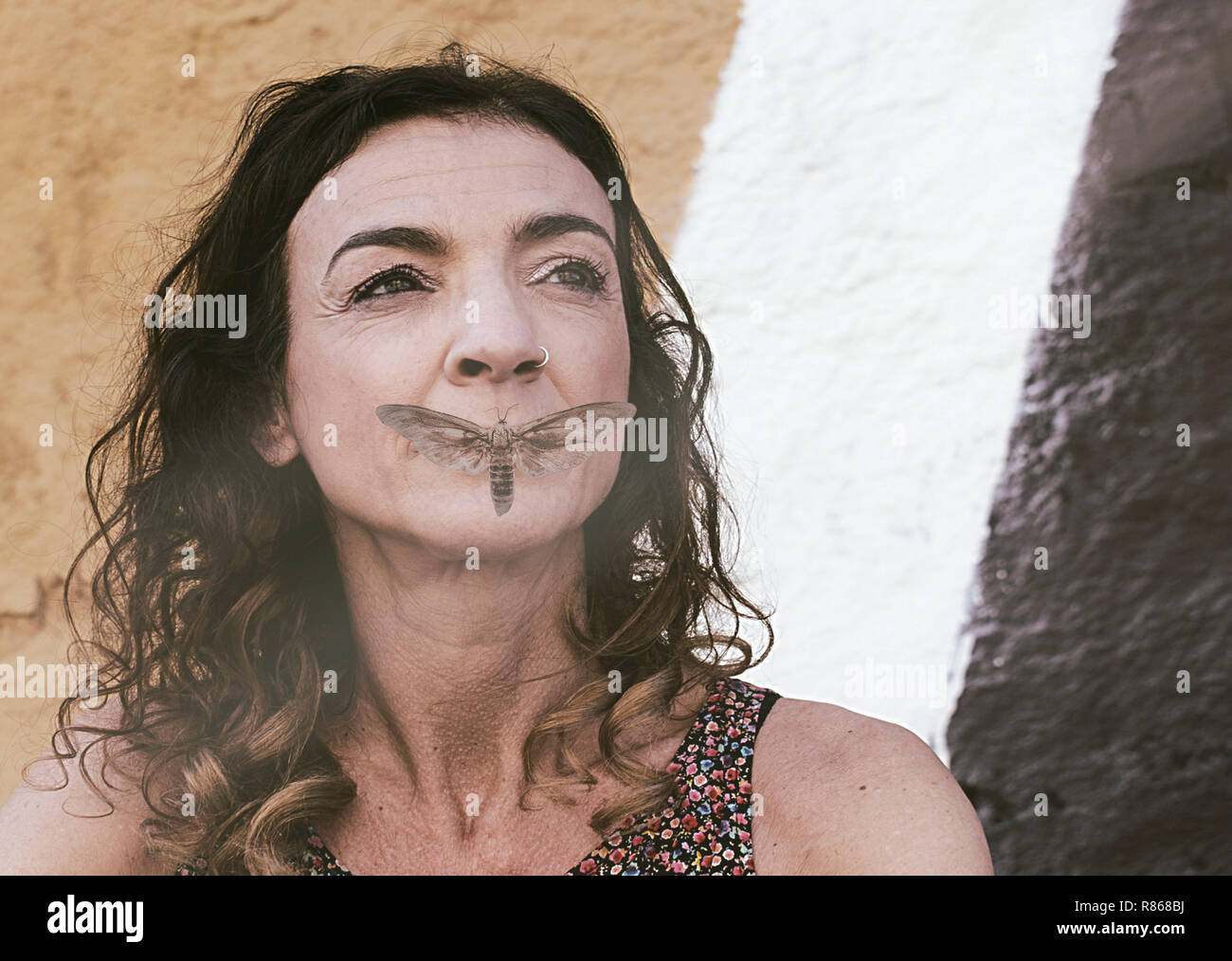 cool woman with chrysalis on the lips Stock Photo - Alamy