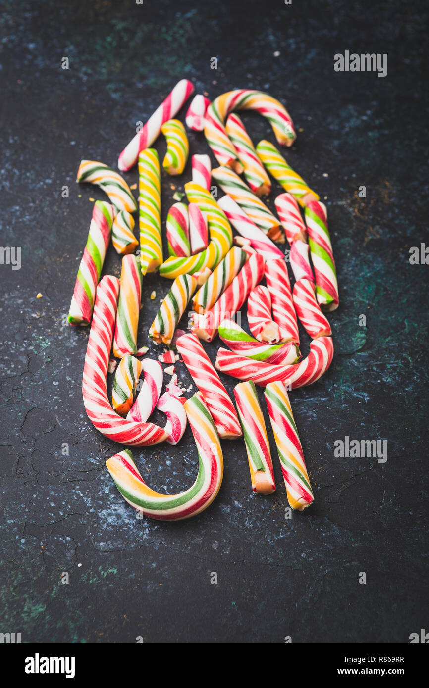 High angle view of a broken candy cane on dark background Stock Photo ...