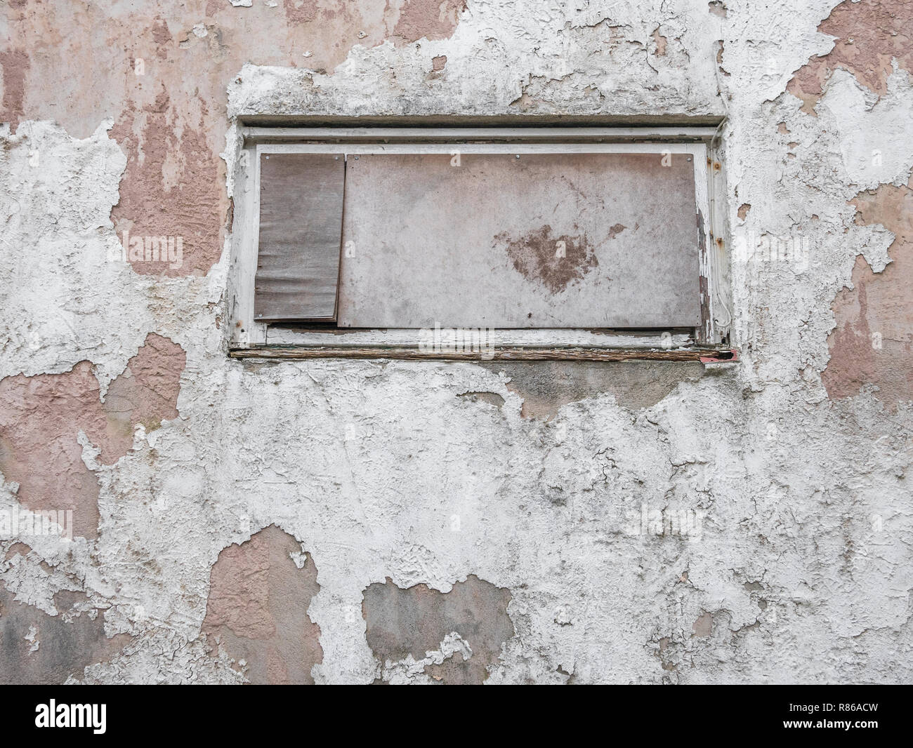 Boarded up window in old building wall Stock Photo - Alamy