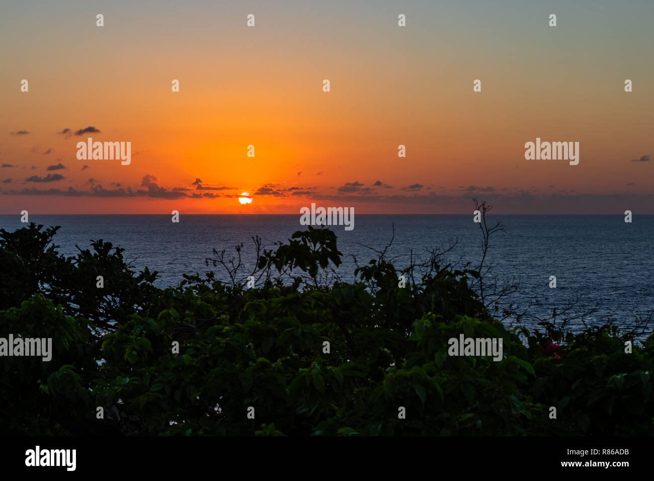 Sunset by the Ocean in Bali, Indonesia Stock Photo - Alamy