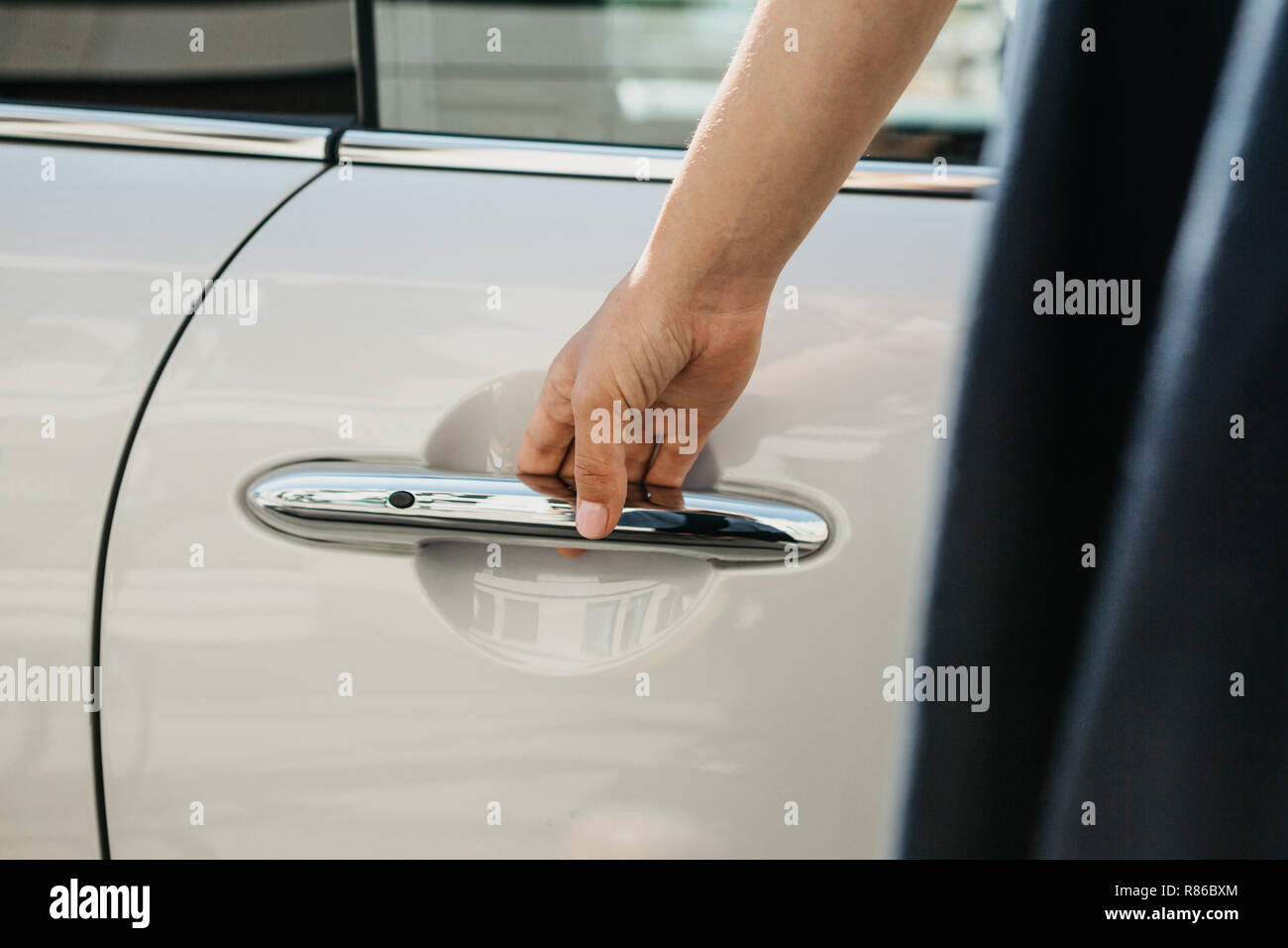 Female driver opening car door hi-res stock photography and images - Alamy