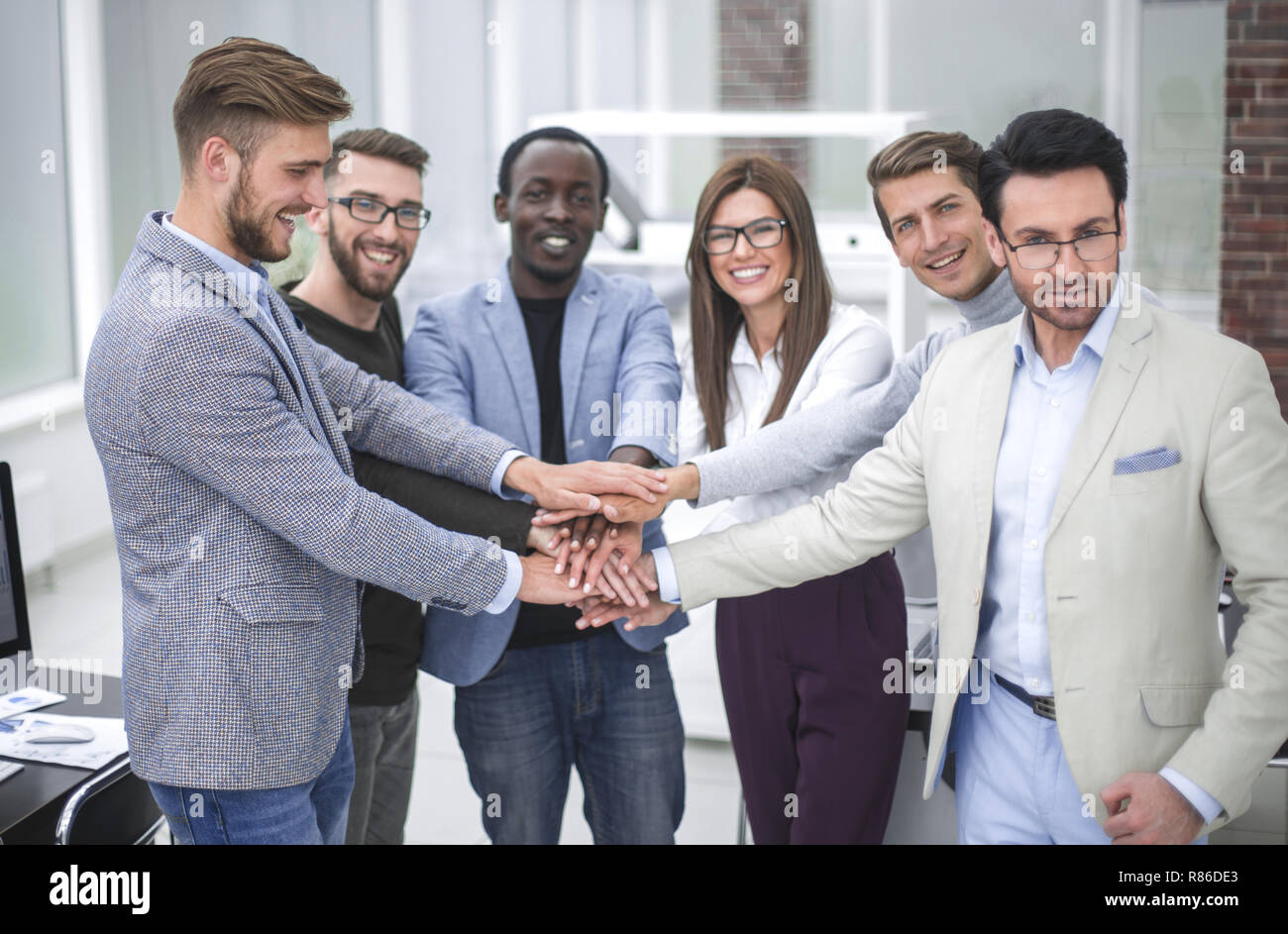 business team shows their unity Stock Photo - Alamy