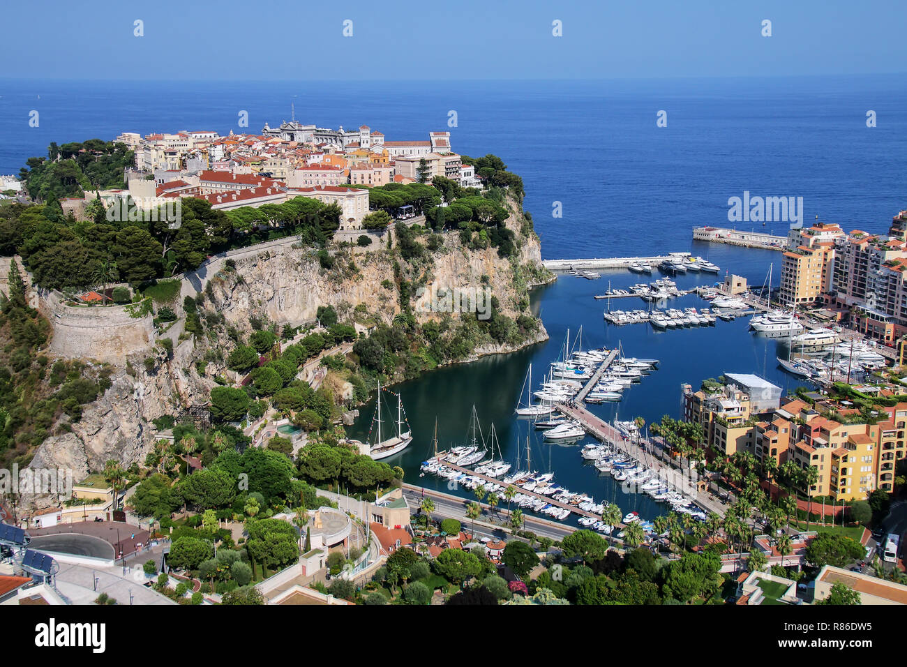 View of Monaco City with boat marina below in Monaco. Monaco City is ...