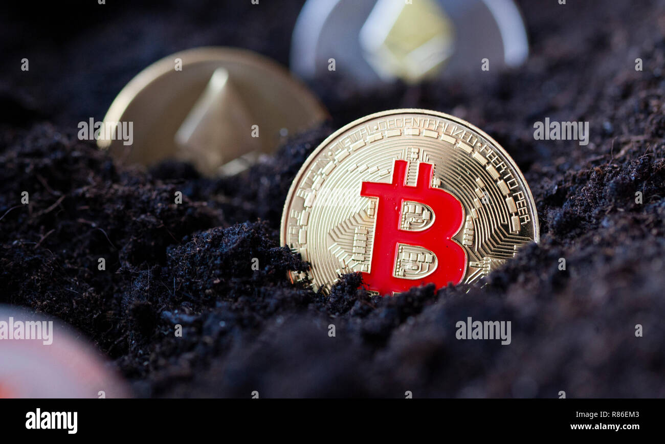 bitcoin in earth - cryptocurrency mining concept Stock Photo - Alamy