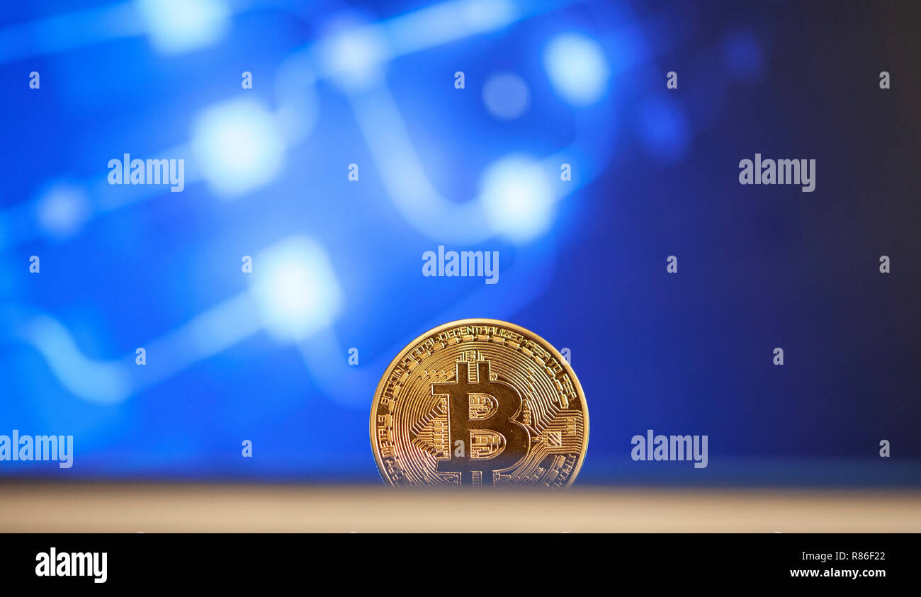 Bitcoin on blue chart hi-res stock photography and images - Alamy