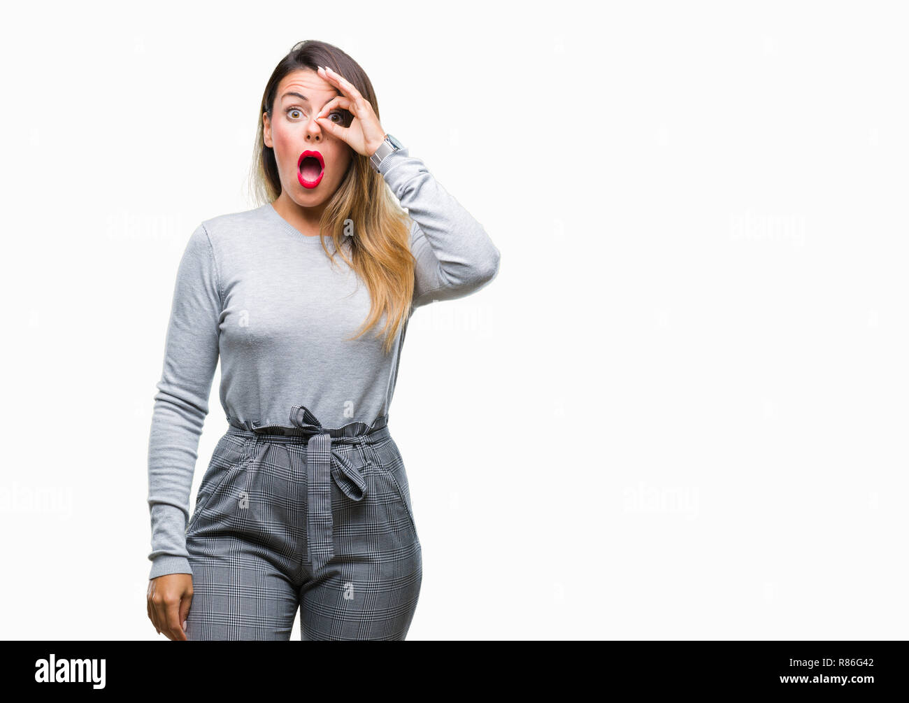 Young beautiful worker business woman over isolated background doing ok ...