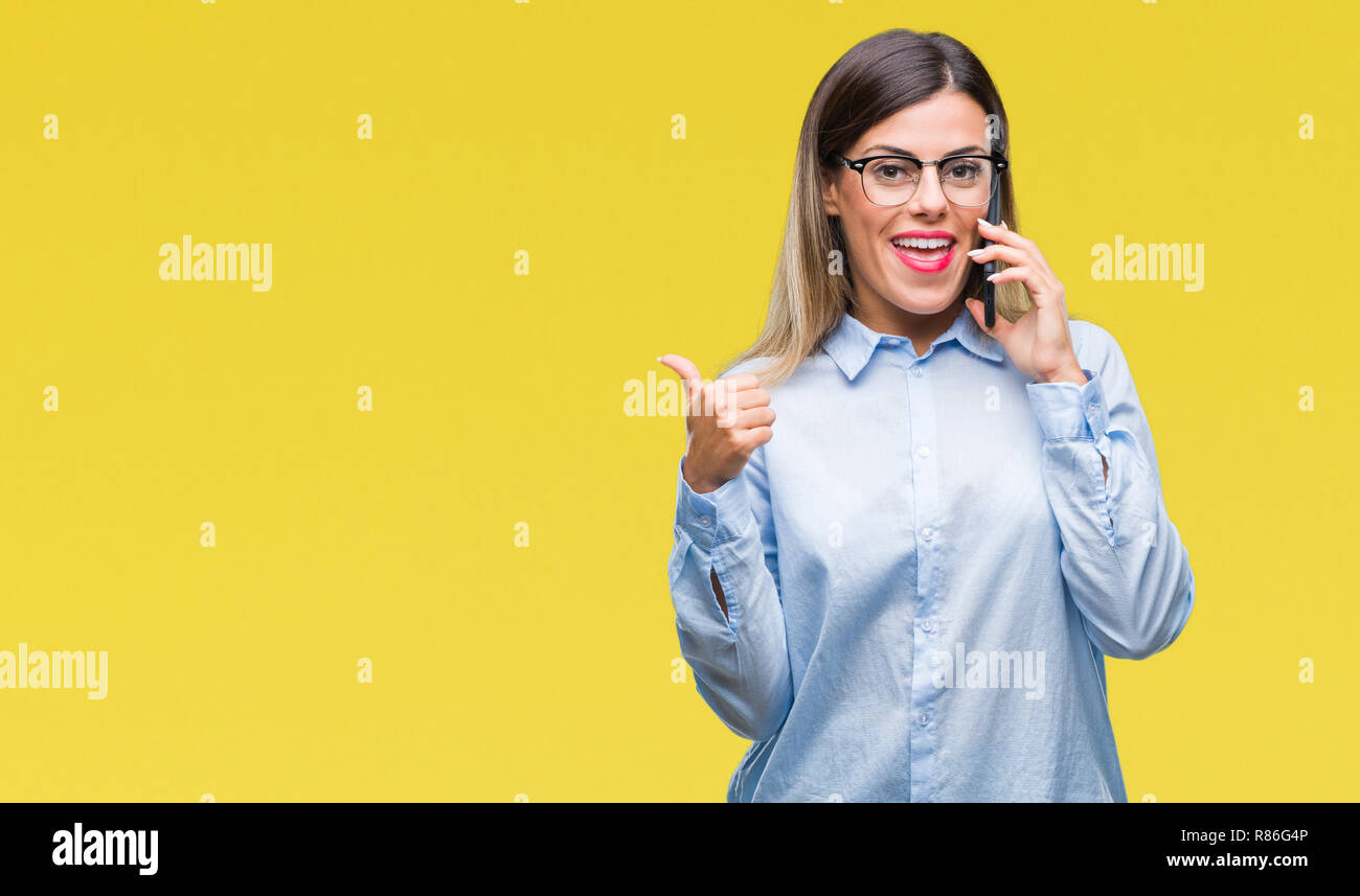 Young beautiful business woman speaking calling using smartphone over ...