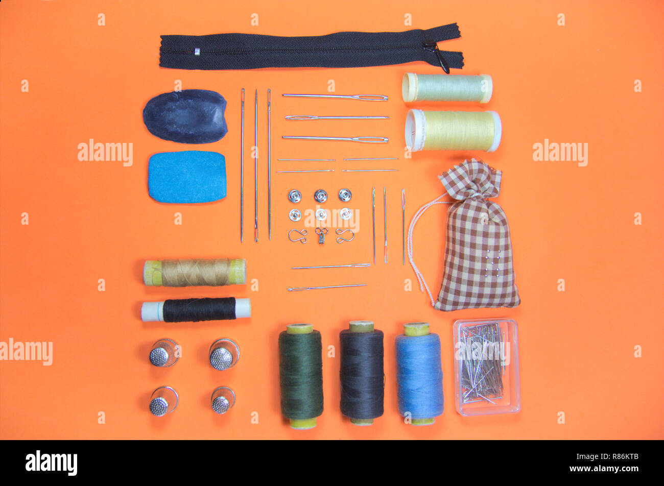 Group of objects related to sewing ordered and viewed from above type ...