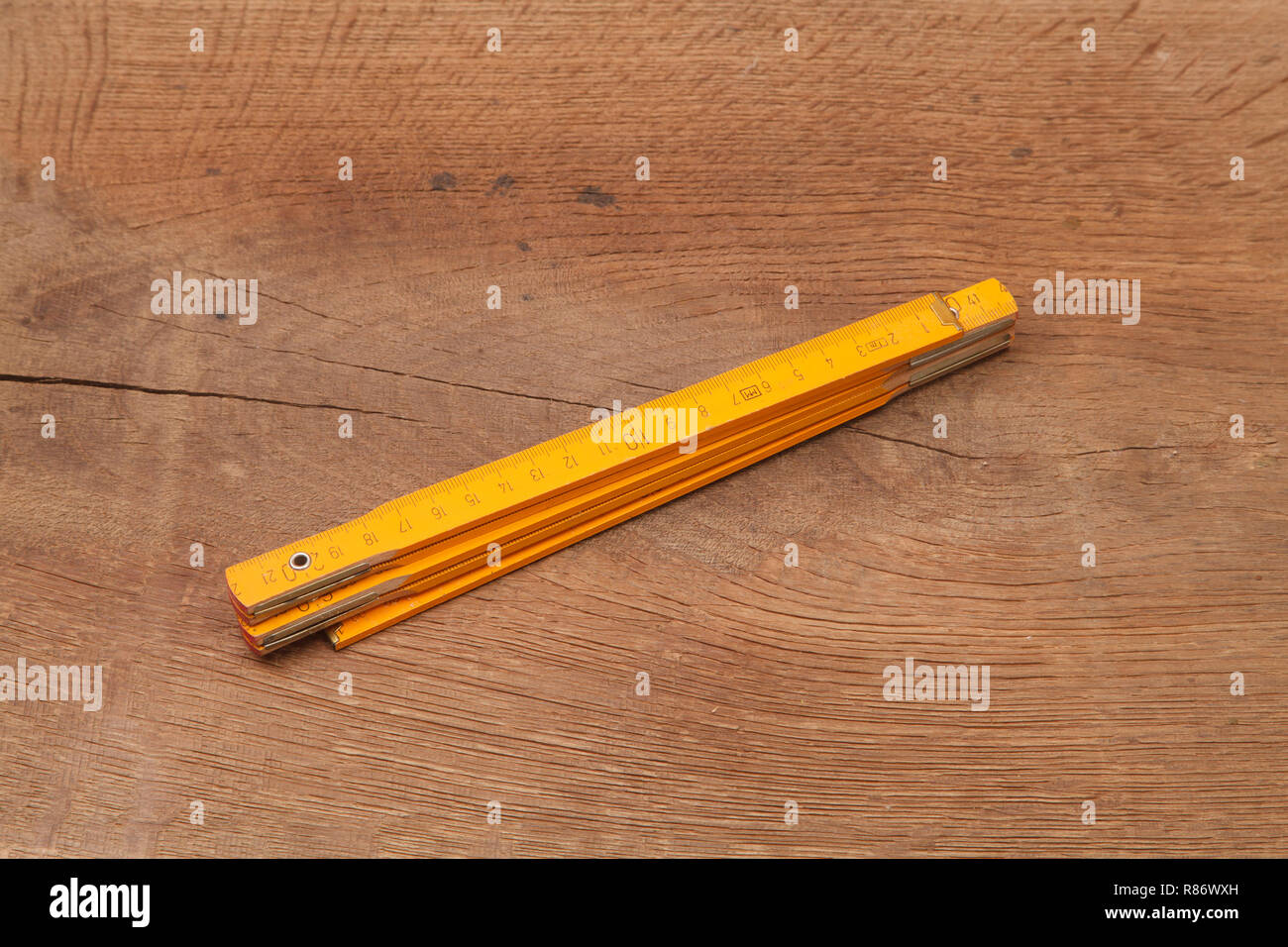 Wooden ruler on wood background Stock Photo - Alamy