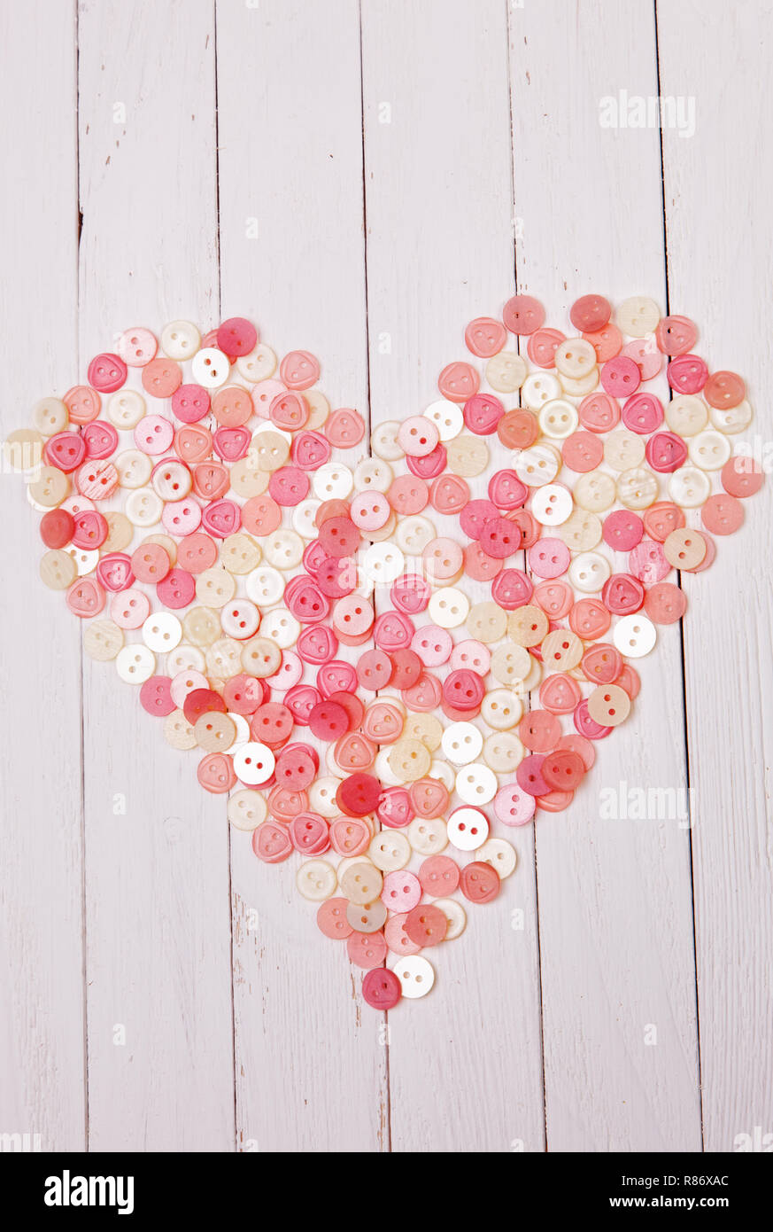 Heart laid out from the buttons Stock Photo - Alamy