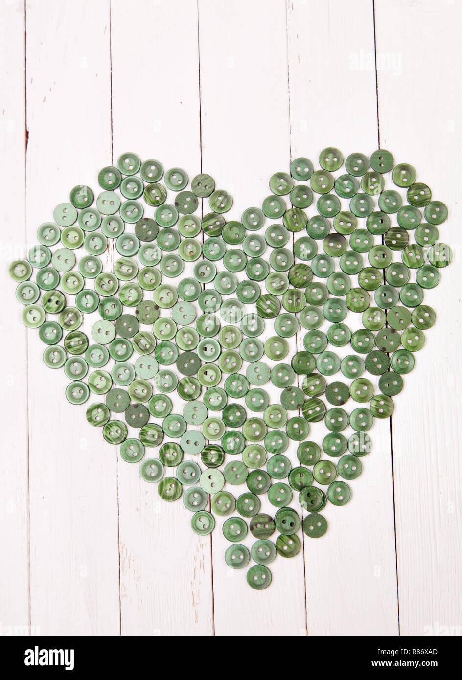 Heart laid out from the buttons Stock Photo - Alamy