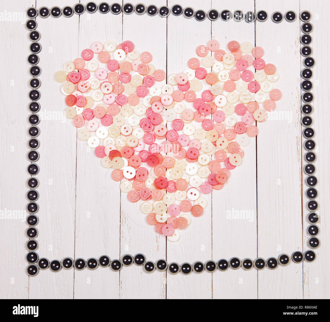Heart laid out from the buttons Stock Photo - Alamy