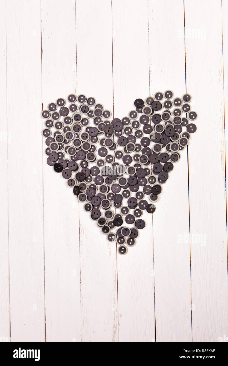 Heart laid out from the buttons Stock Photo - Alamy