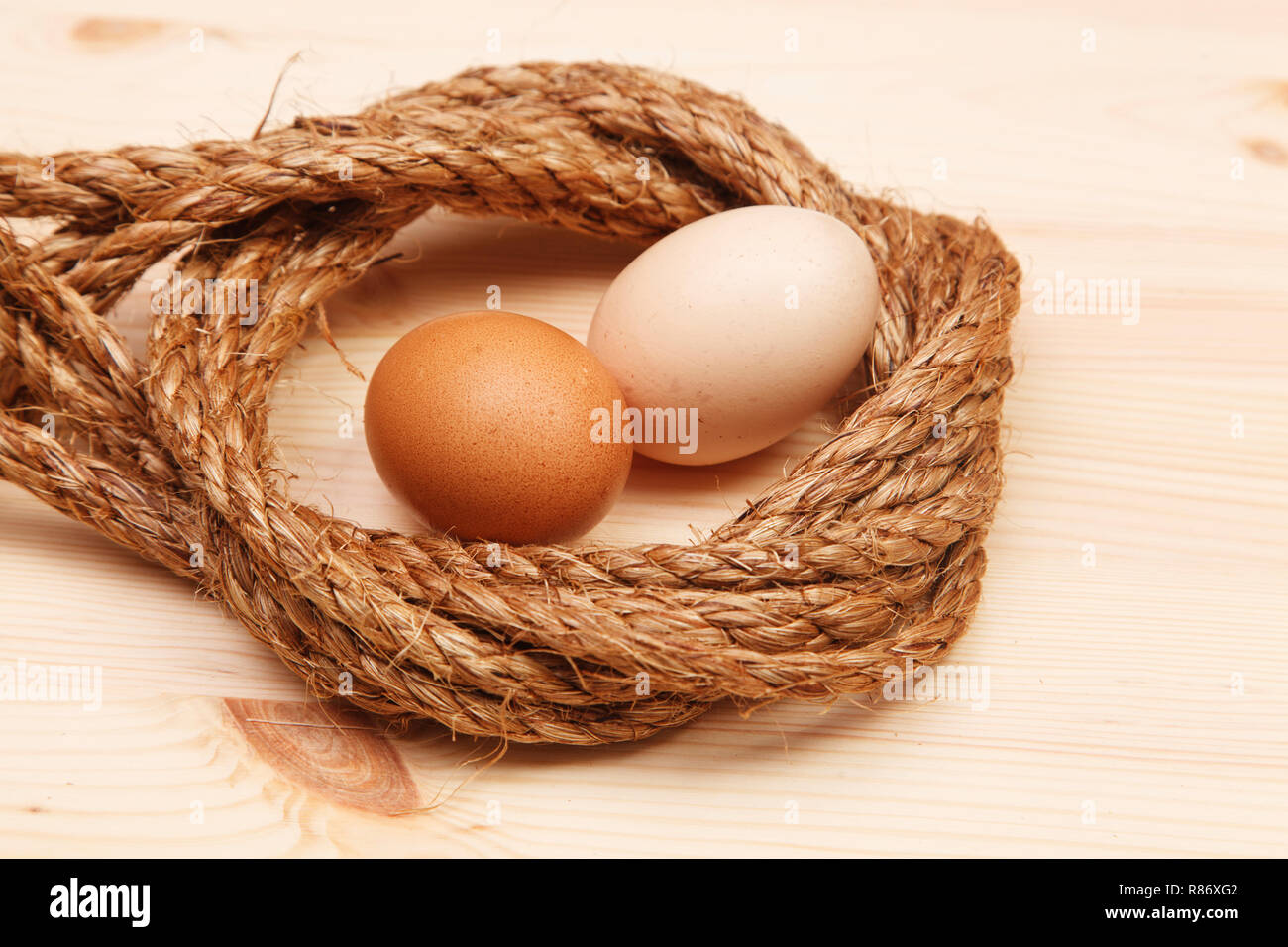 Fresh Egg With rope Harvest on Wood Table Background Stock Photo - Alamy