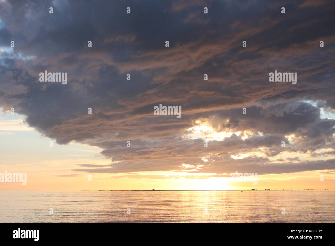amazing sunset with heavy dark blue clouds scary weather background ...