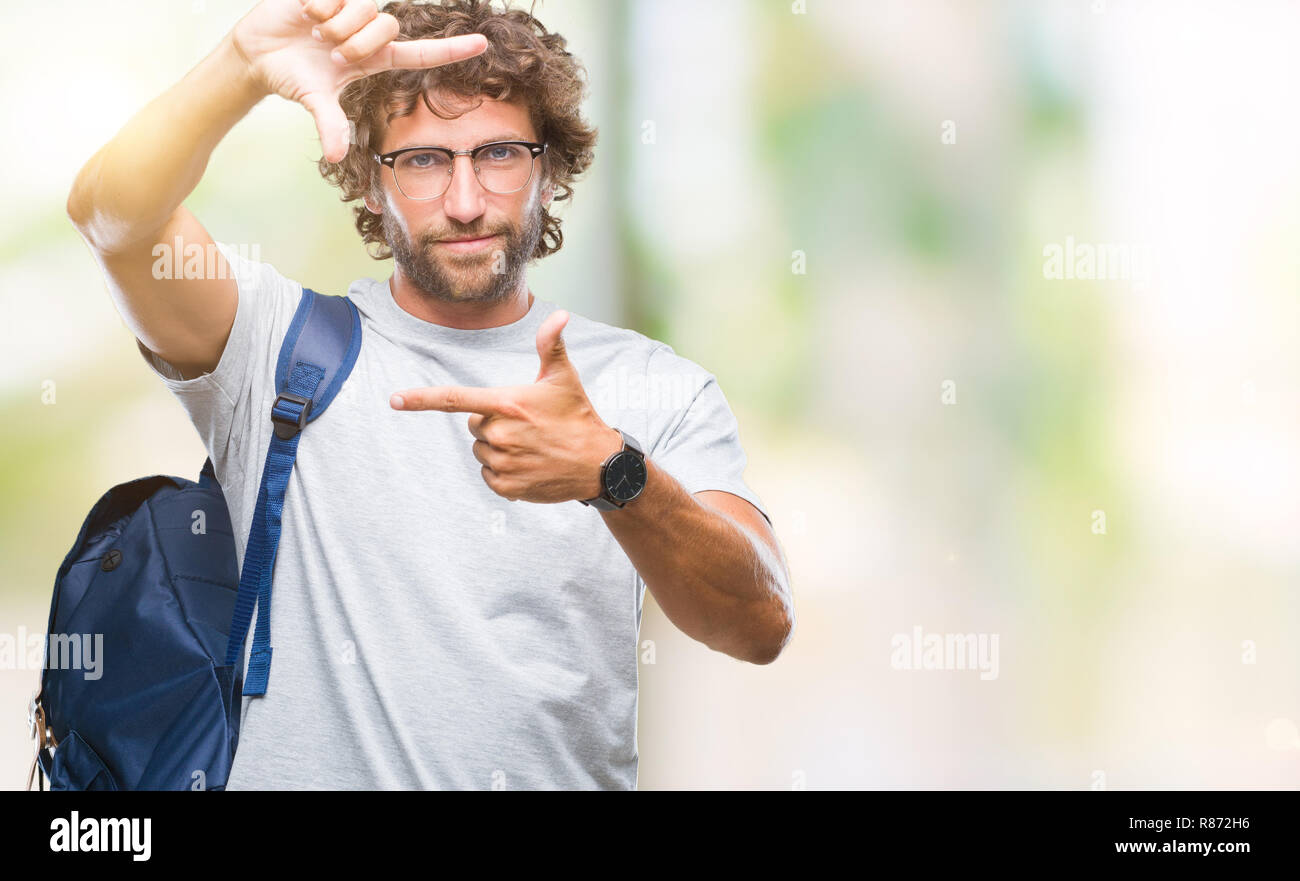 Handsome hispanic student man wearing backpack and glasses over ...