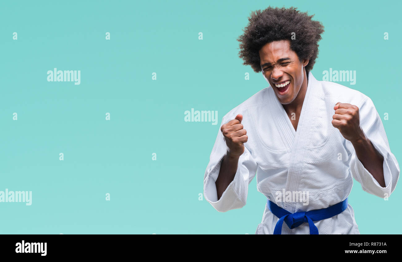 Afro american man wearing karate kimono over isolated background very ...