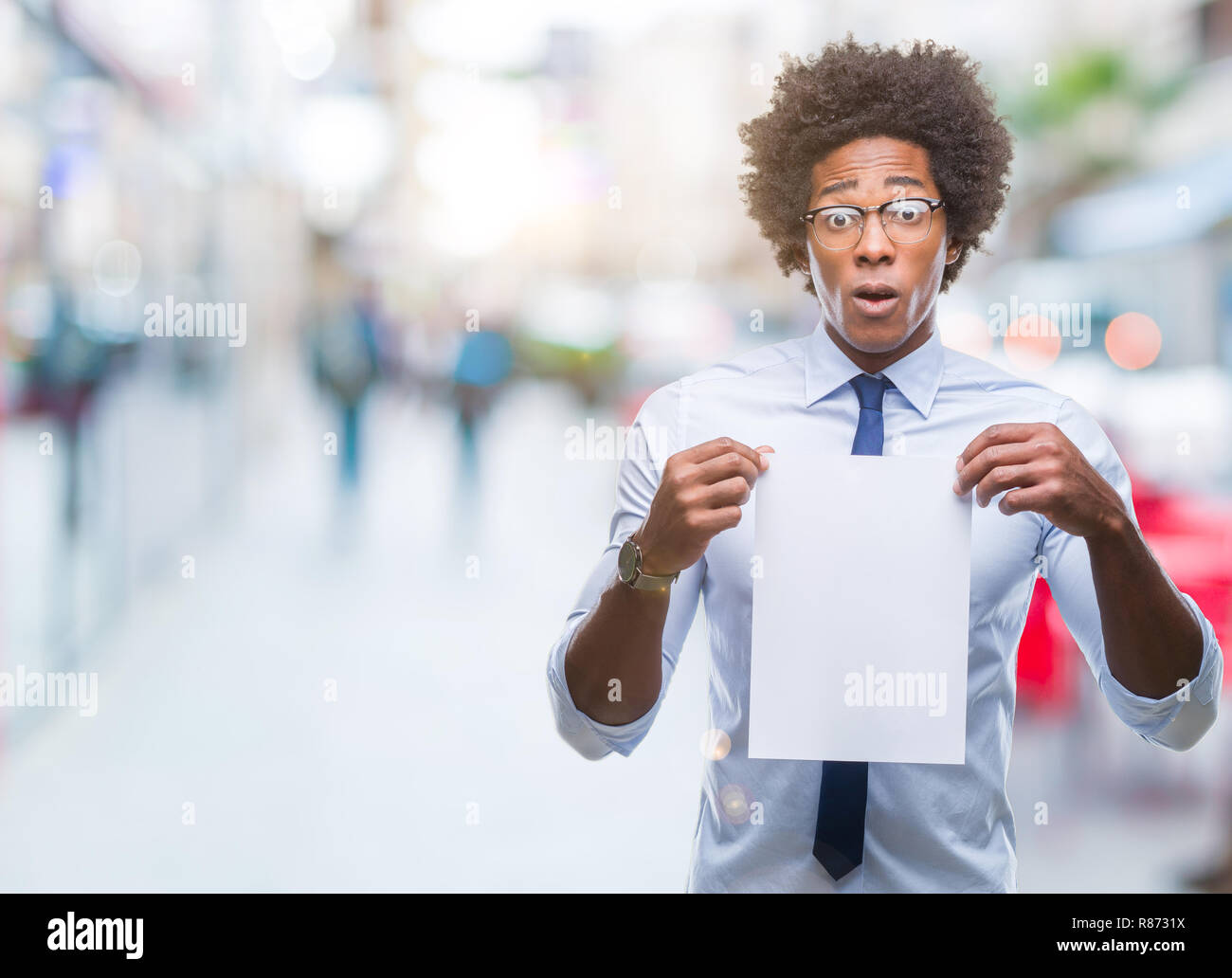 Afro american man holding blank paper contract over isolated background ...