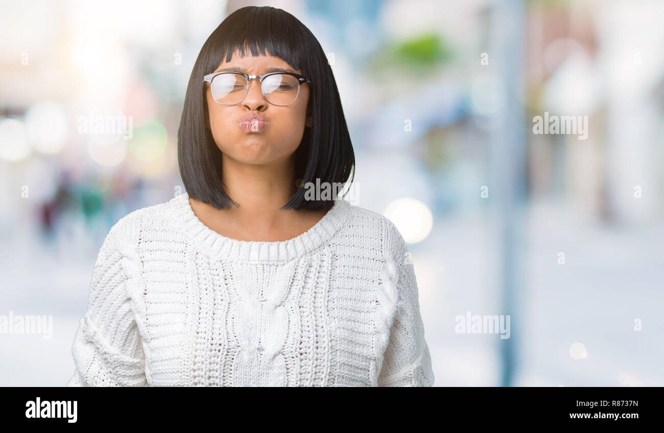 Beautiful young african american woman wearing glasses over isolated ...