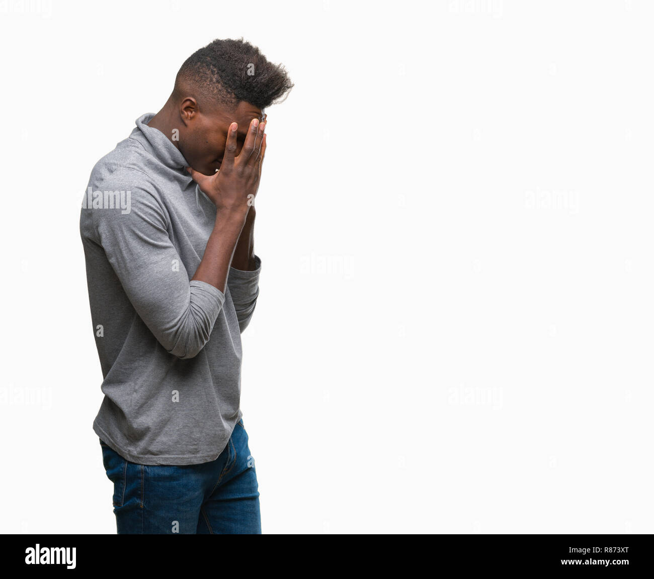 Young african american man over isolated background with sad expression ...