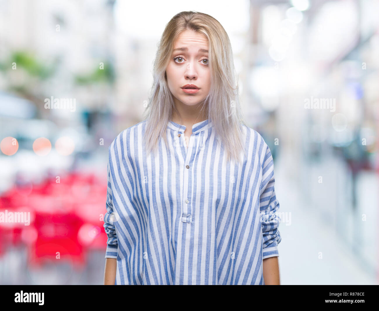 Young blonde woman over isolated background depressed and worry for ...