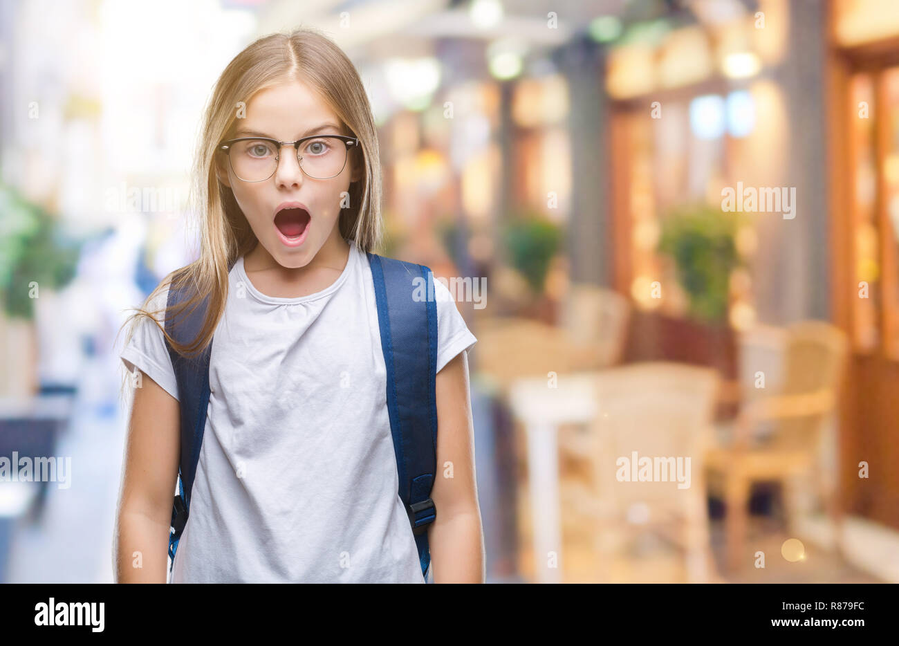 Young beautiful smart student girl wearing backpack over isolated ...