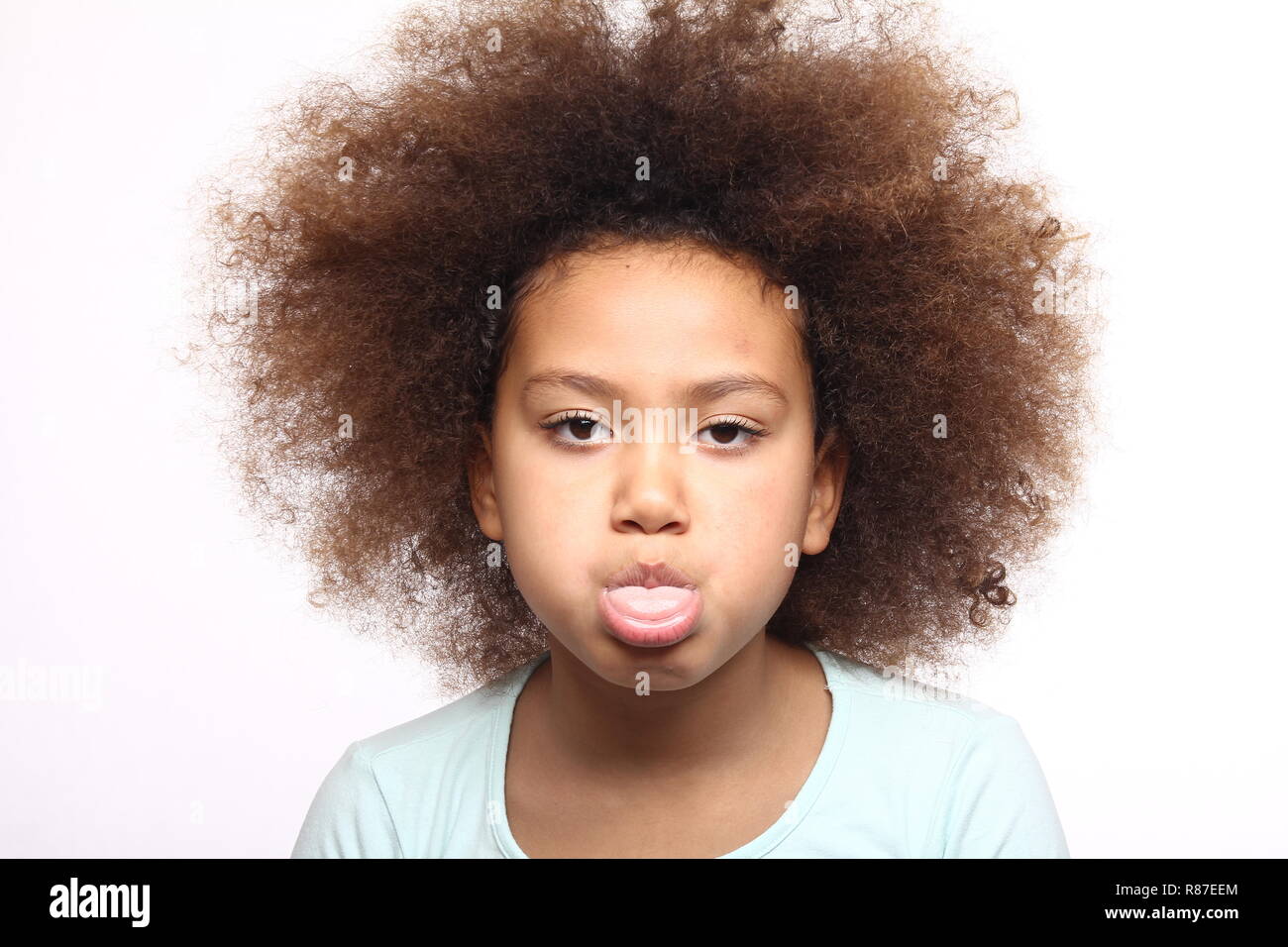 Beautiful little afro girl in front of a background Stock Photo - Alamy