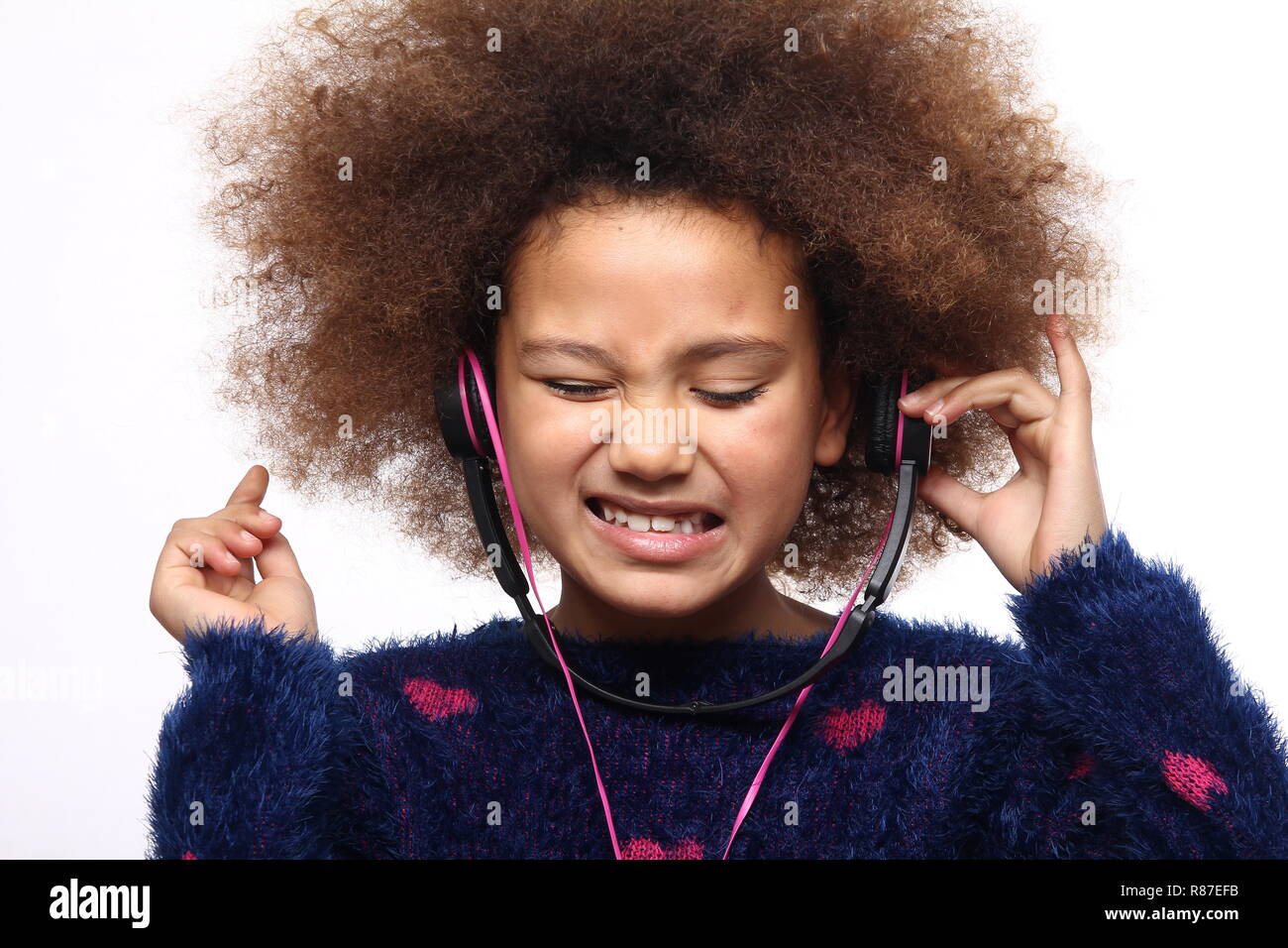 Beautiful little afro girl in front of a background Stock Photo - Alamy