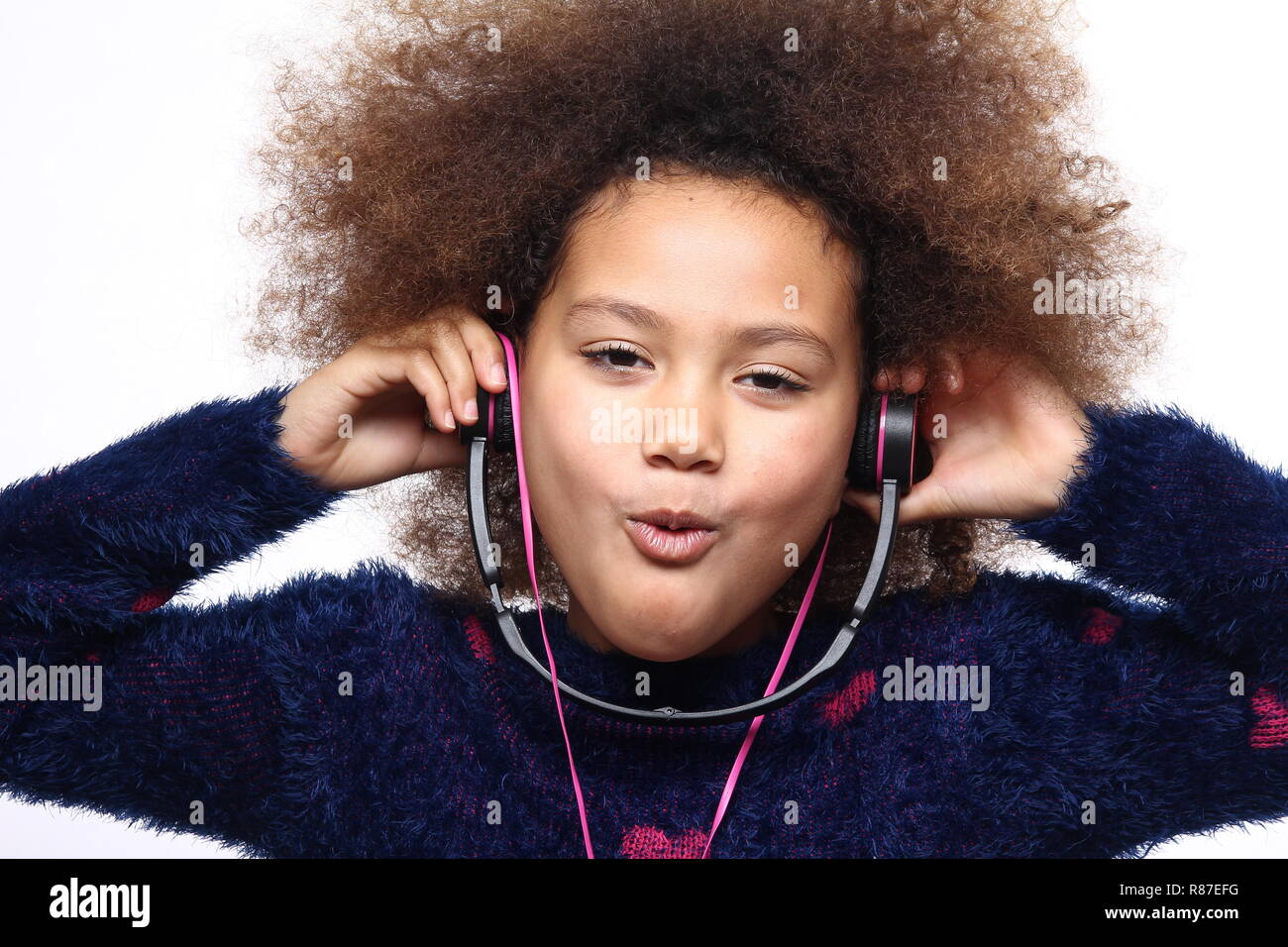 Beautiful little afro girl in front of a background Stock Photo - Alamy
