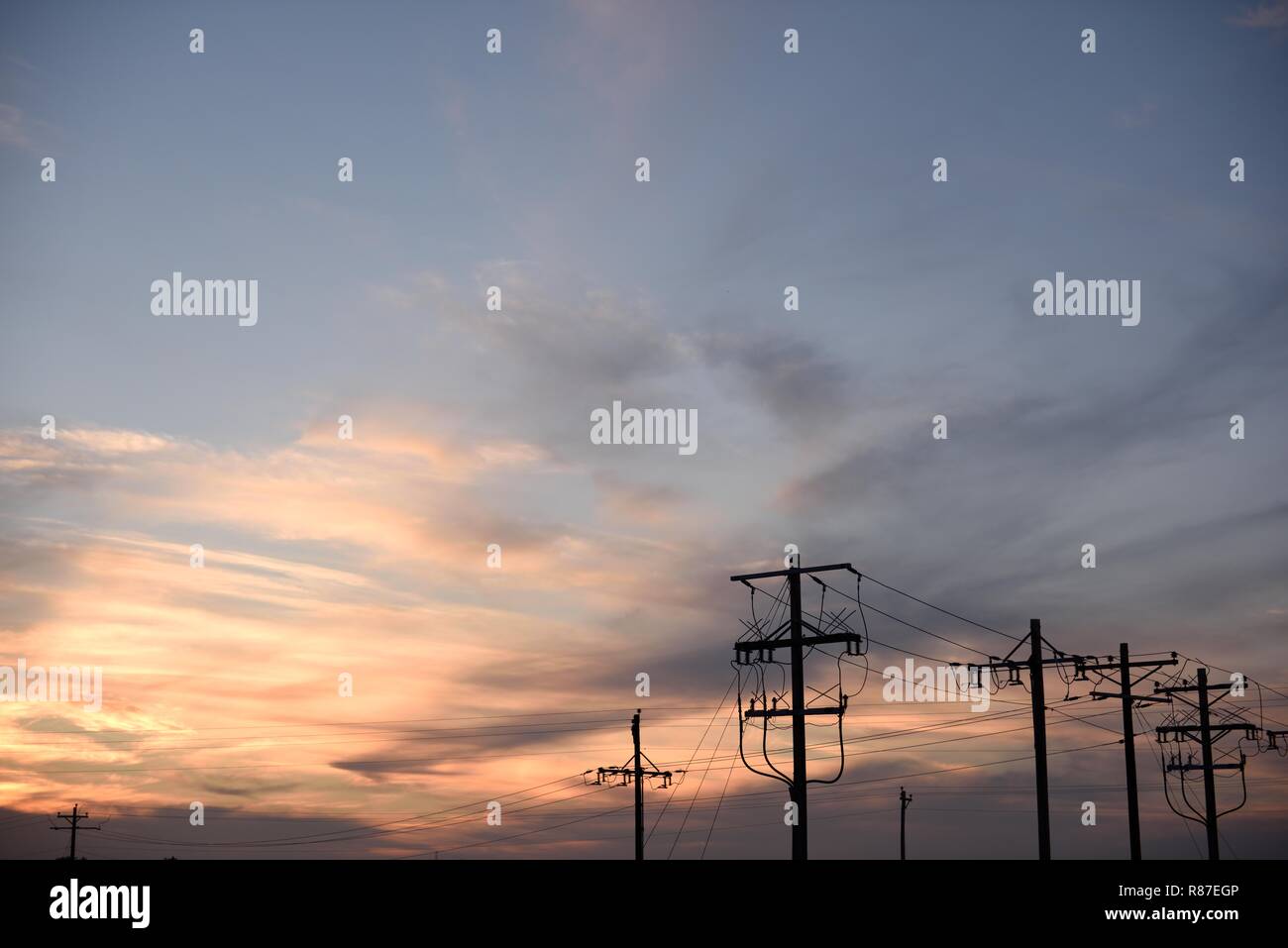 Power grid silhouette, utility poles and electrical high voltage power ...