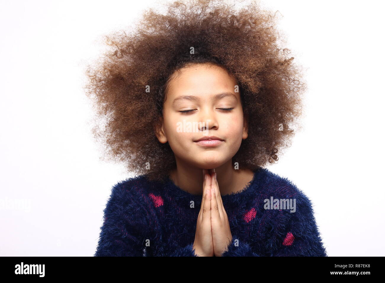 Beautiful little afro girl in front of a background Stock Photo - Alamy