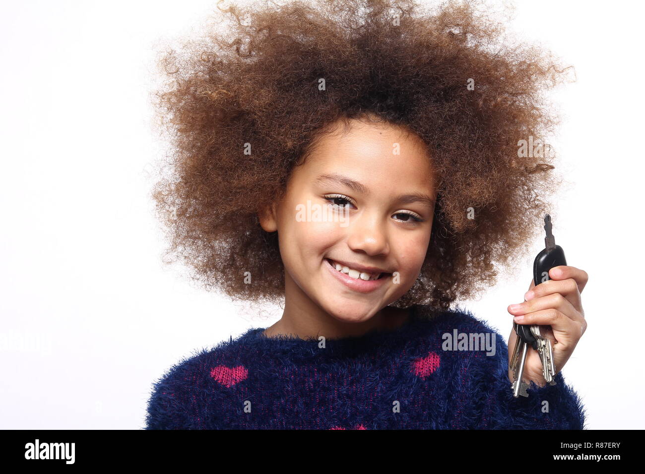Beautiful little afro girl in front of a background Stock Photo - Alamy