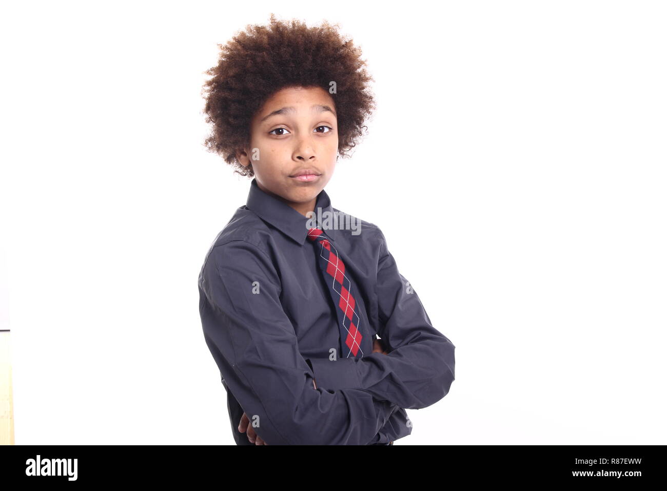 Beautiful afro boy in front of a background Stock Photo - Alamy