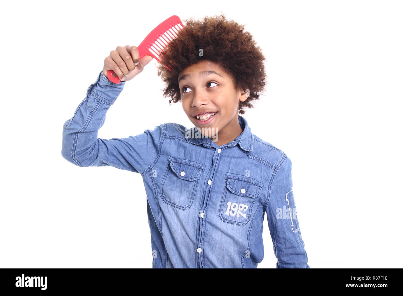 Beautiful afro boy in front of a background Stock Photo - Alamy