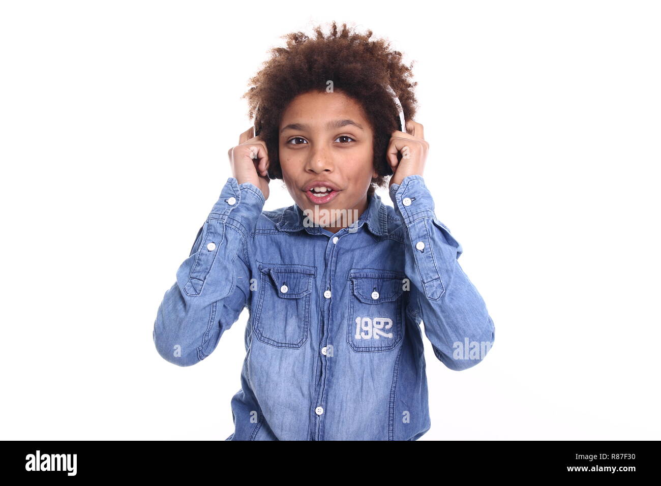 Beautiful afro boy in front of a background Stock Photo - Alamy