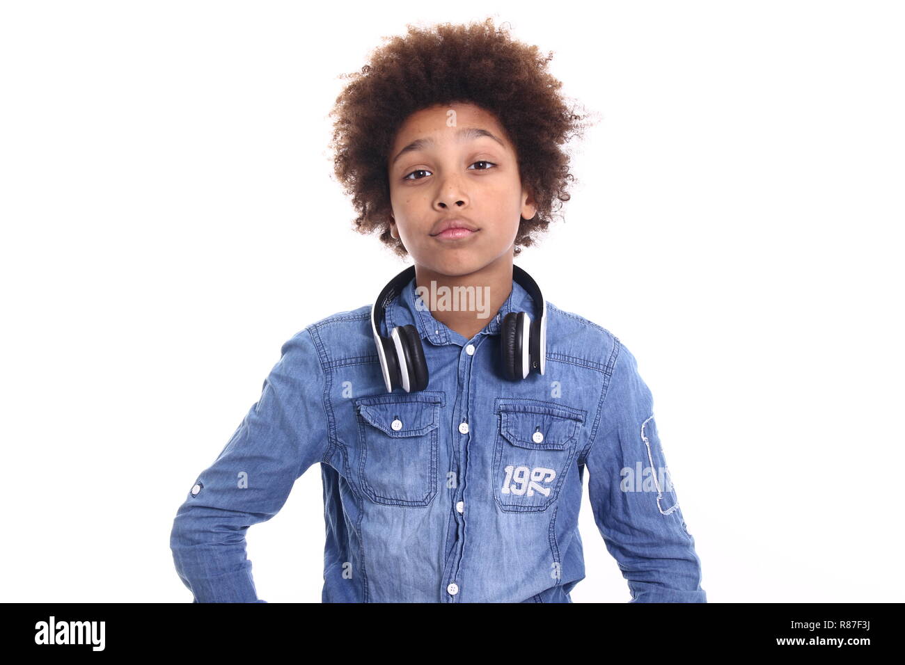 Beautiful afro boy in front of a background Stock Photo - Alamy