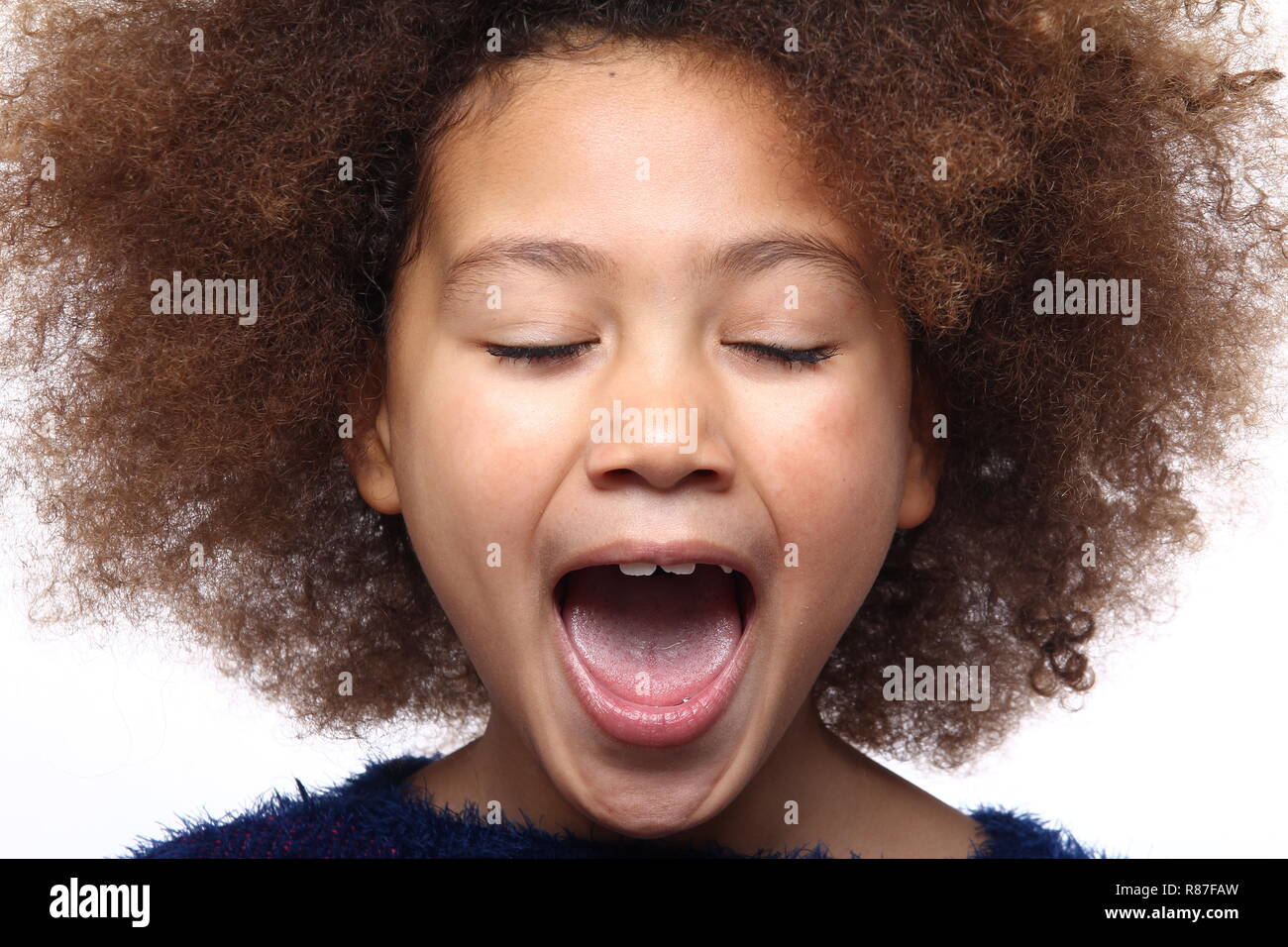 Beautiful little afro girl in front of a background Stock Photo - Alamy