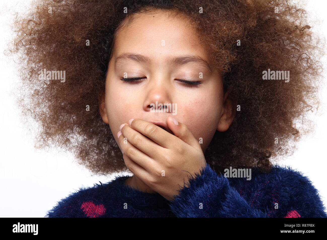 Beautiful little afro girl in front of a background Stock Photo - Alamy