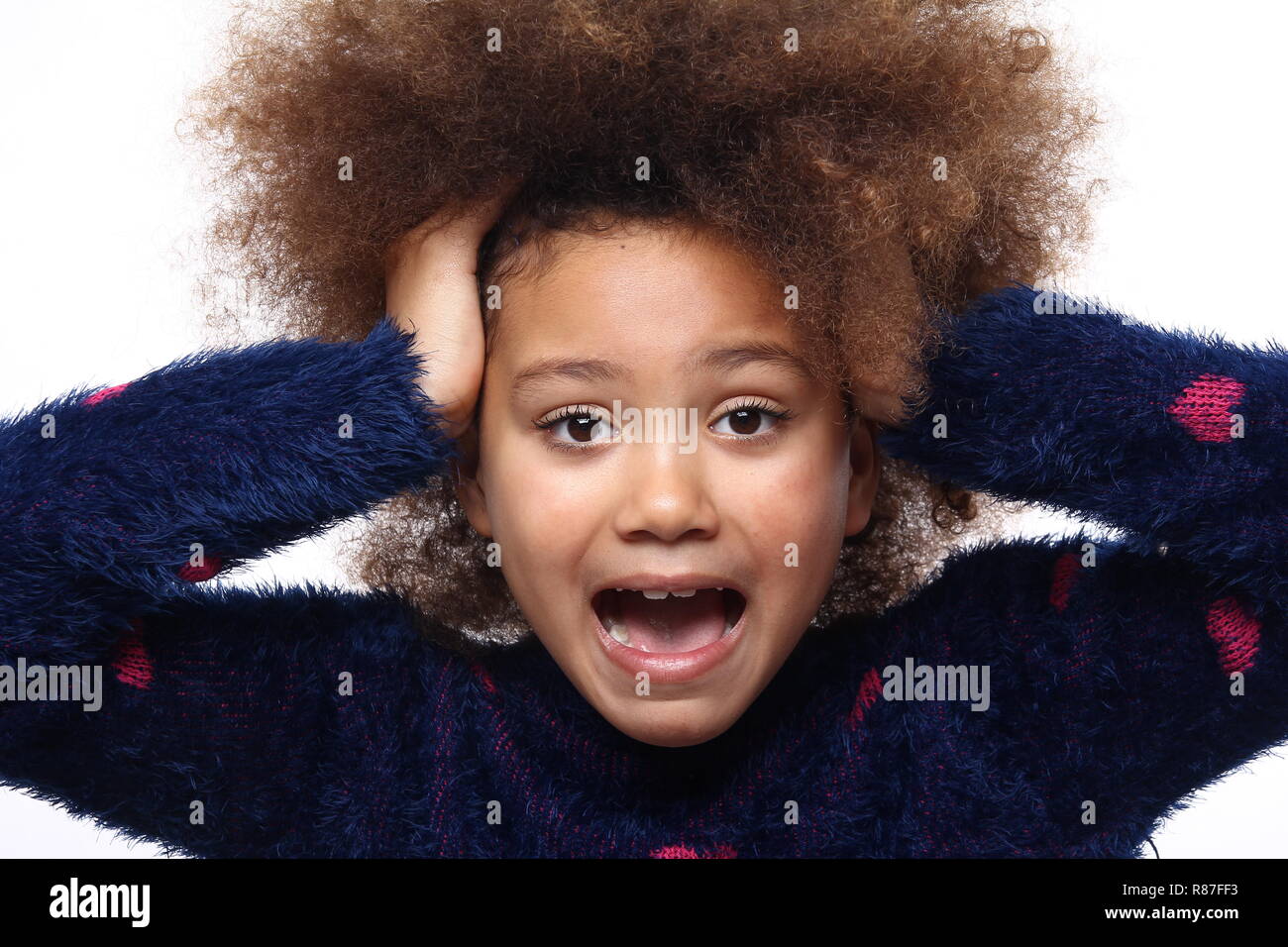 Beautiful little afro girl in front of a background Stock Photo - Alamy