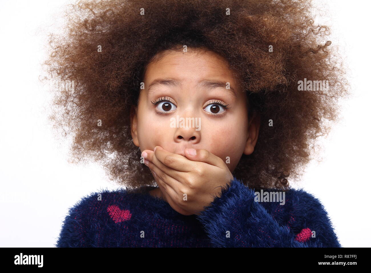 Beautiful little afro girl in front of a background Stock Photo - Alamy