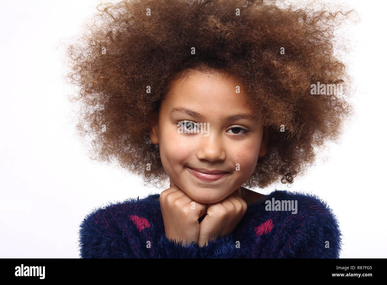 Beautiful little afro girl in front of a background Stock Photo - Alamy