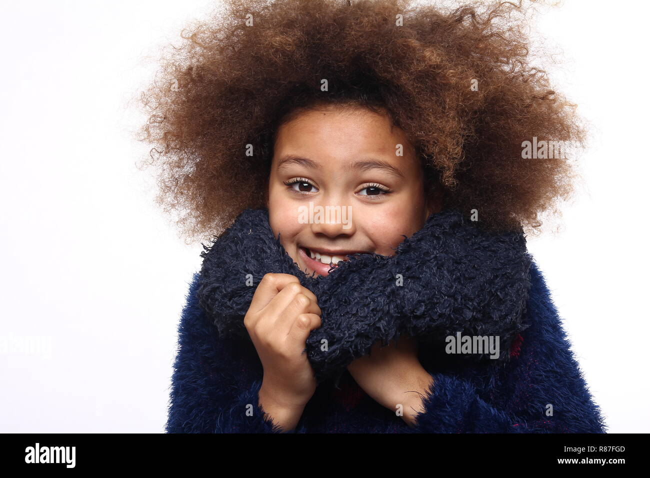 Beautiful little afro girl in front of a background Stock Photo - Alamy