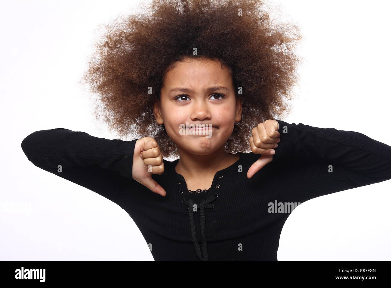 Beautiful little afro girl in front of a background Stock Photo - Alamy