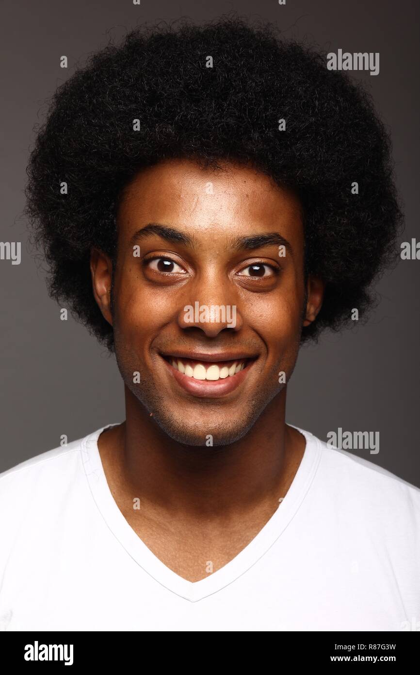 Beautiful man in front of a white background Stock Photo - Alamy