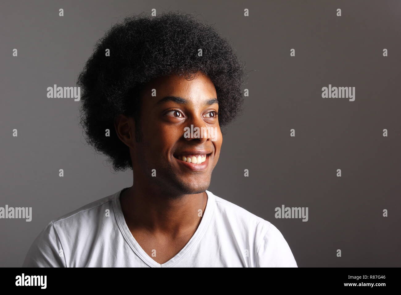 Beautiful man in front of a white background Stock Photo - Alamy