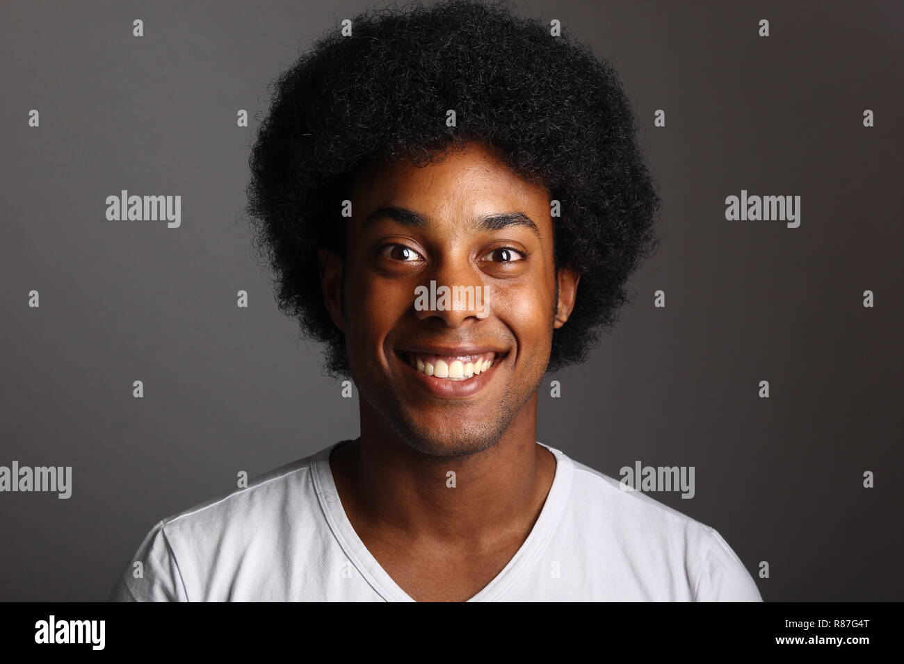 Beautiful man in front of a white background Stock Photo - Alamy
