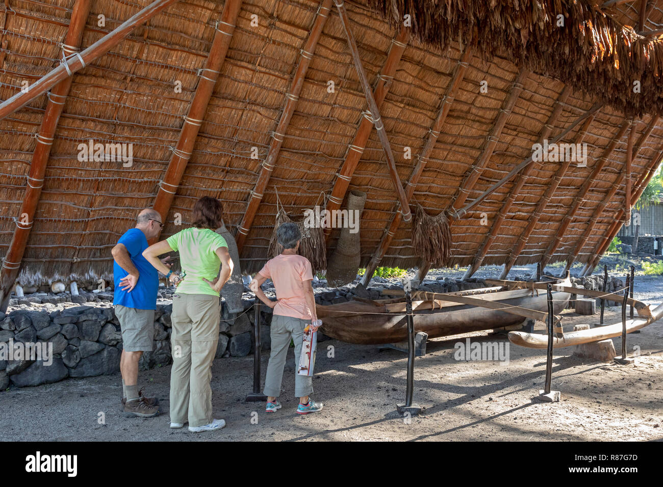 Honaunau, Hawaii - Visitors inspect an ocean-going canoe in the halau ...