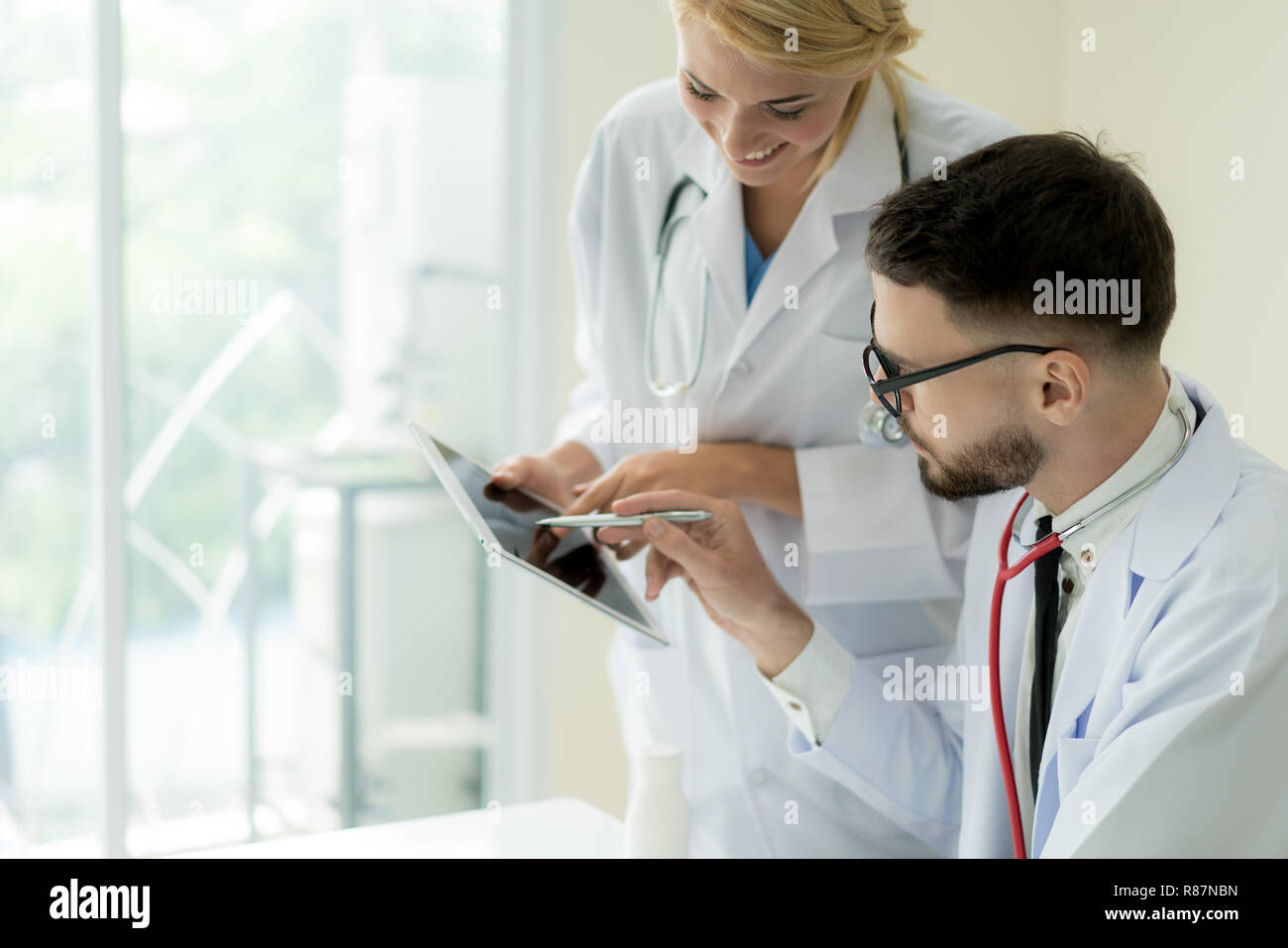 Two doctors talking hospital hi-res stock photography and images - Alamy
